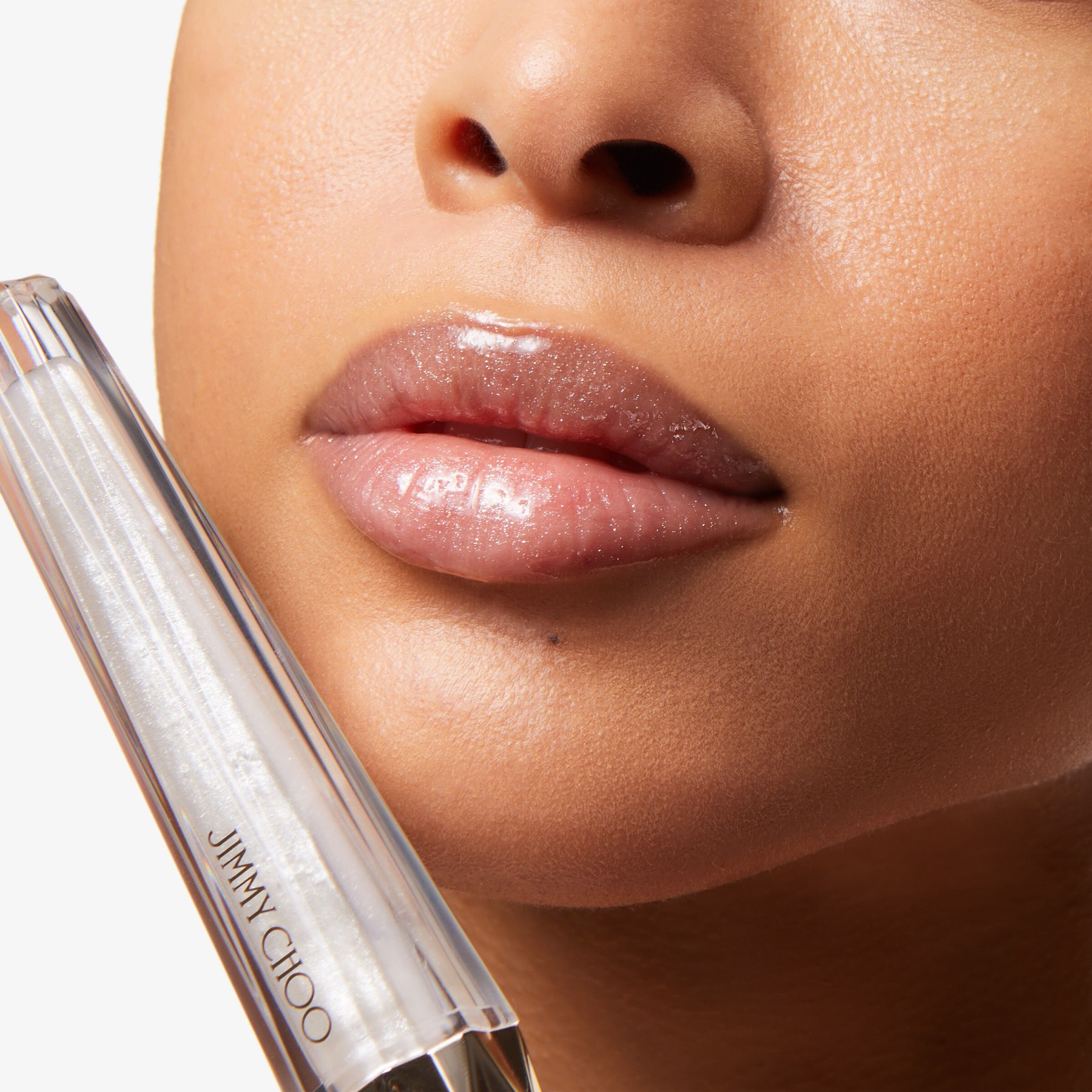 Pure Glow Clear Glitter Plumping Lip Gloss | Beauty Collection | JIMMY CHOO