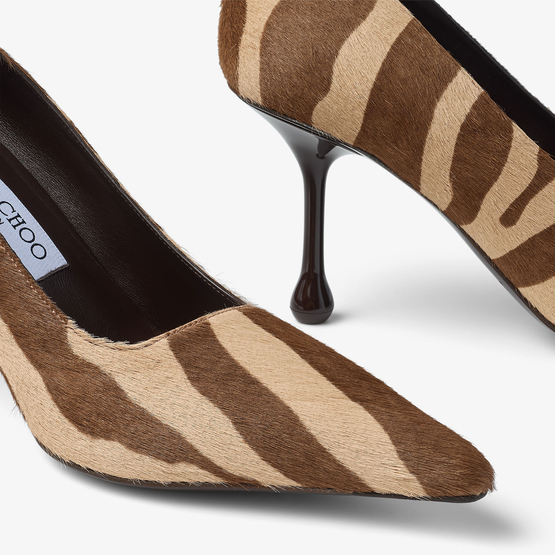 Ixia 80 | Chocolate Zebra Printed Pony Pumps | JIMMY CHOO