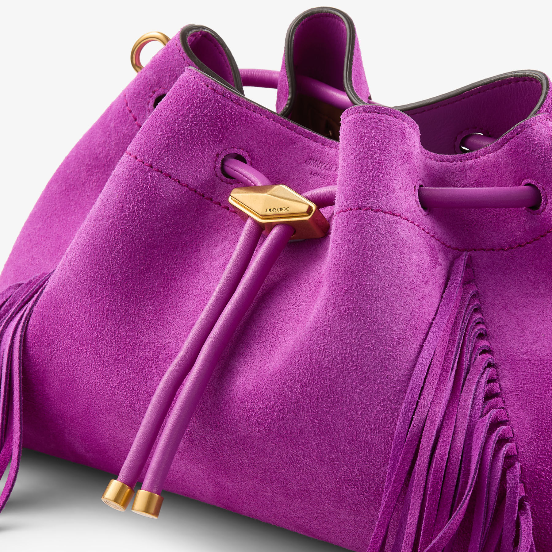 Cinch Medium | Violet Orchid Suede Bucket Bag with Fringes | JIMMY CHOO