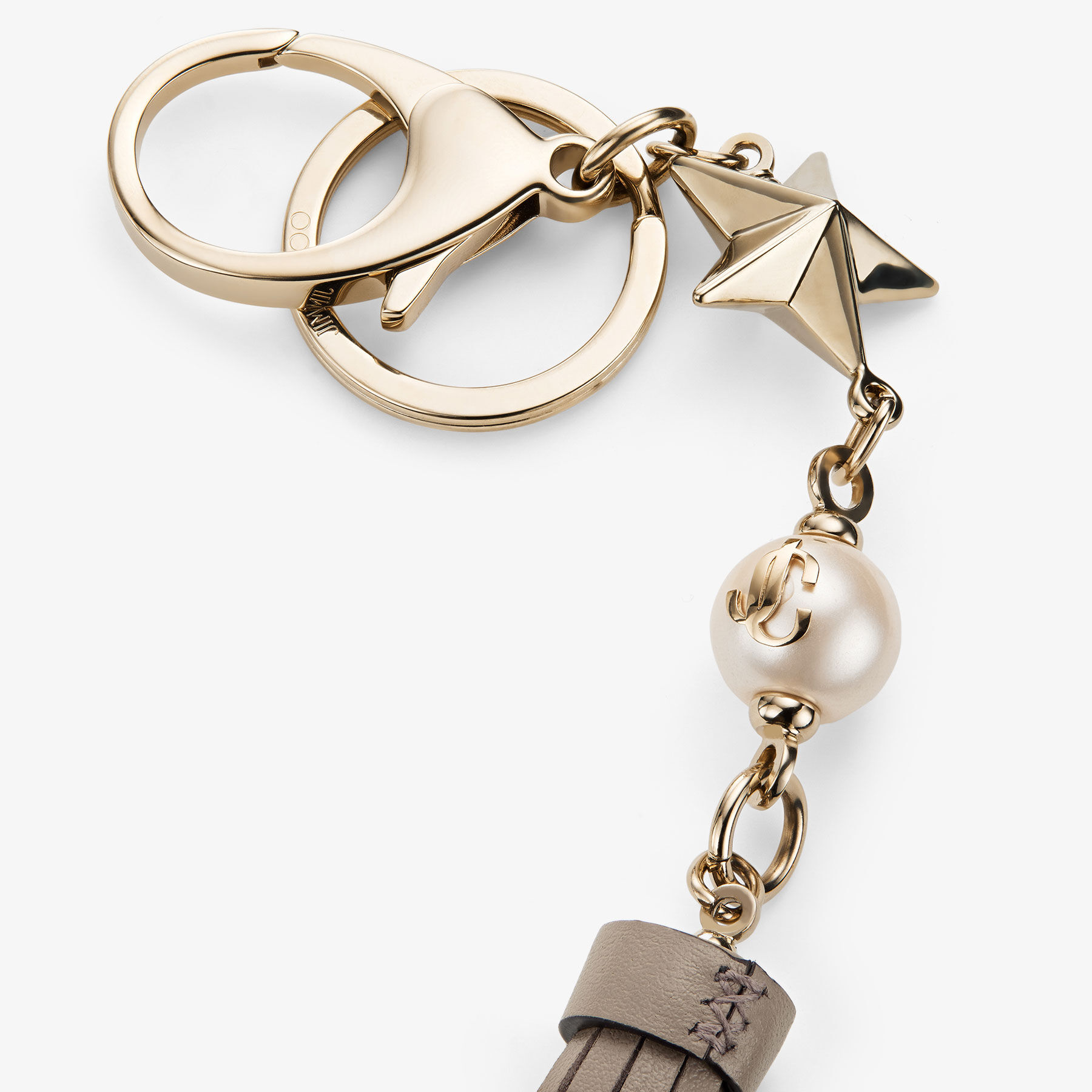 JC Star Tassel Charm |Taupe Calf Leather Star Tassel Bag Charm | JIMMY ...